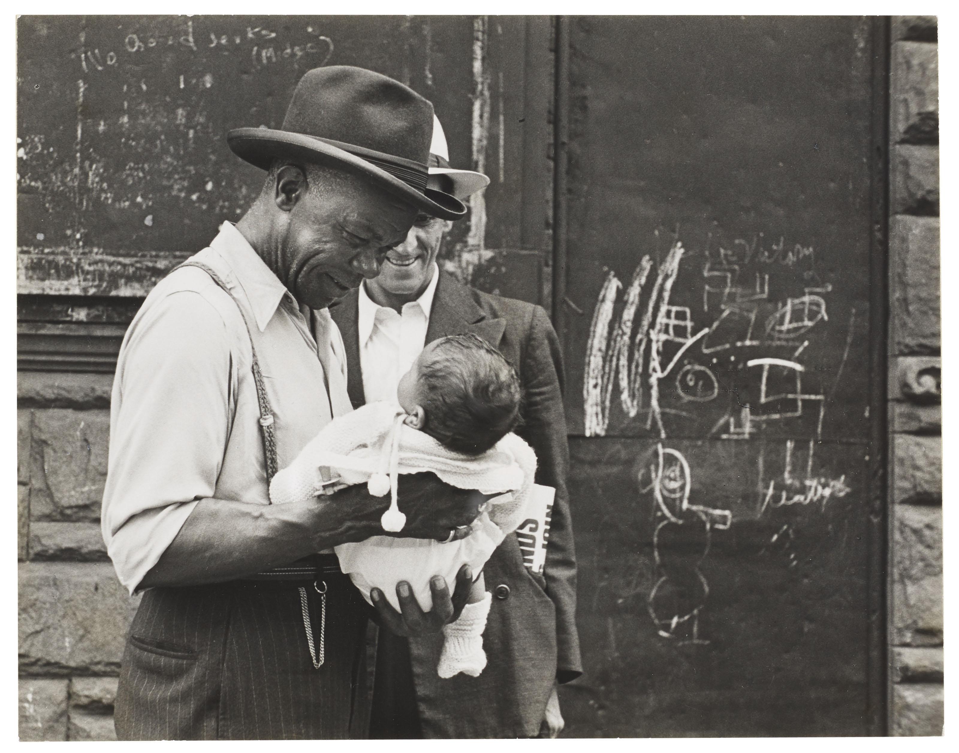New York City (Man holding baby), c. 1939 by Helen Levitt | Art.Salon